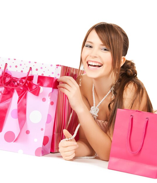 Imagen De Niña Feliz Con Bolsas De Regalo De Colores Foto Premium