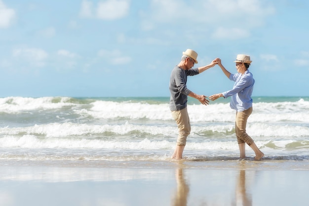Premium Photo Asian Senior Couple Dancing On The Beach Elderly