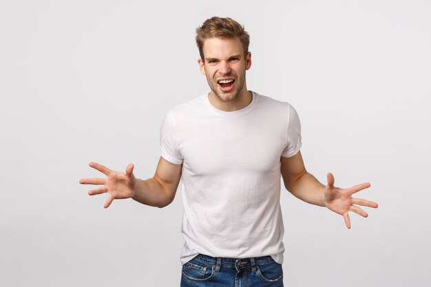 Premium Photo Attractive Blond Bearded Man In White T Shirt Showing