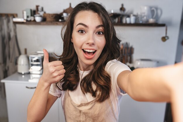 Premium Photo Attractive Brunette Woman Wearing Apron Taking A Selfie
