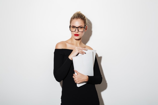 Free Photo | Attractive business woman in dress and eyeglasses holding ... Free Photo | Attractive business woman in dress and eyeglasses holding ...