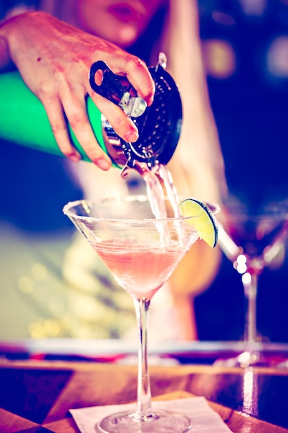 Premium Photo Bartender Preparing Cosmopolitan Drink For Customer
