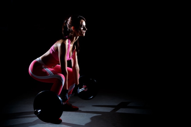 Premium Photo Beautiful Fitness Woman Doing Squats With A Barbell