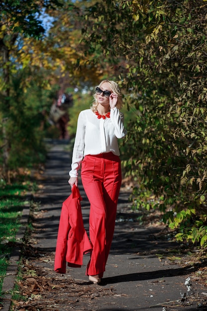 Premium Photo Beautiful Girl In A Red Suit In Autumn