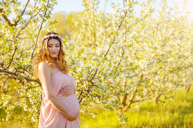 Premium Photo Beautiful Pregnant Woman Holds Hands On Belly In The