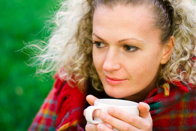 Premium Photo Beautiful Woman Holding A Cup Of Hot Drink