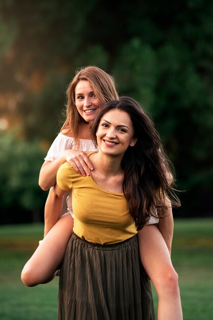 Premium Photo Beautiful Women Having Fun In The Park Friends And