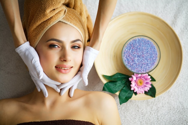 Premium Photo Beauty And Care Cosmetologist Makes Face Massage