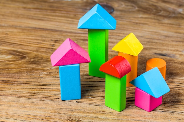 Free Photo | Building blocks on wooden background,colorful wooden ... Free Photo | Building blocks on wooden background,colorful wooden ...