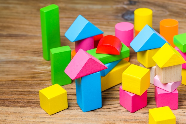 Free Photo | Building blocks on wooden background,colorful wooden ... Free Photo | Building blocks on wooden background,colorful wooden ...