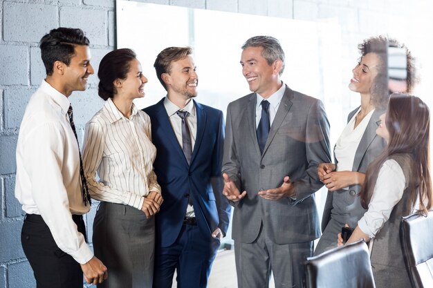 Premium Photo | Business people interacting with each other in ... Premium Photo | Business people interacting with each other in ...