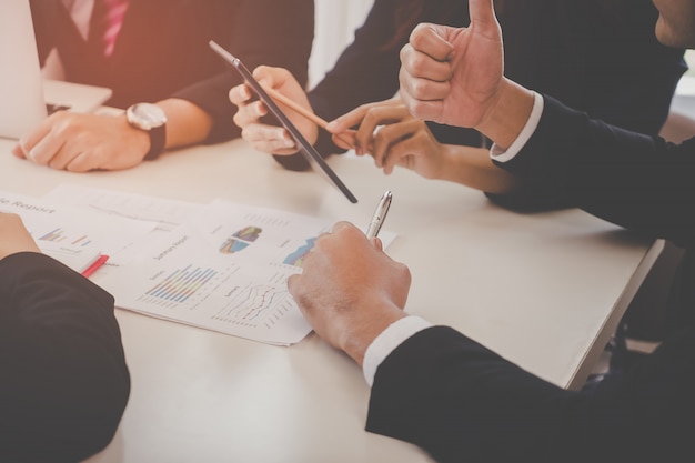 Premium Photo | Business team is seriously discussing in meeting, no face Premium Photo | Business team is seriously discussing in meeting, no face