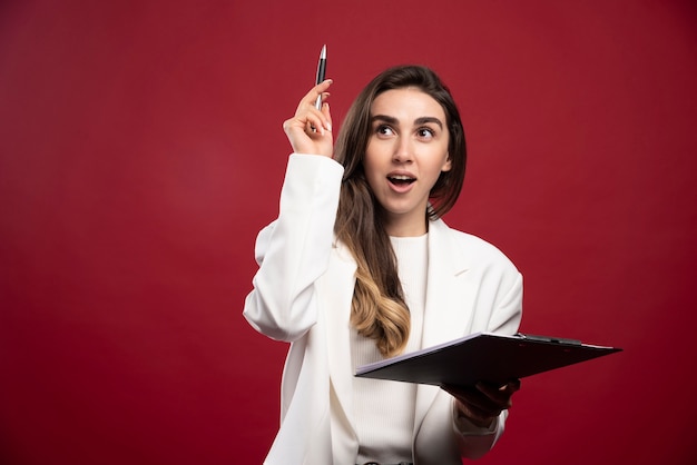 Free Photo | Business woman holding a notebook Free Photo | Business woman holding a notebook