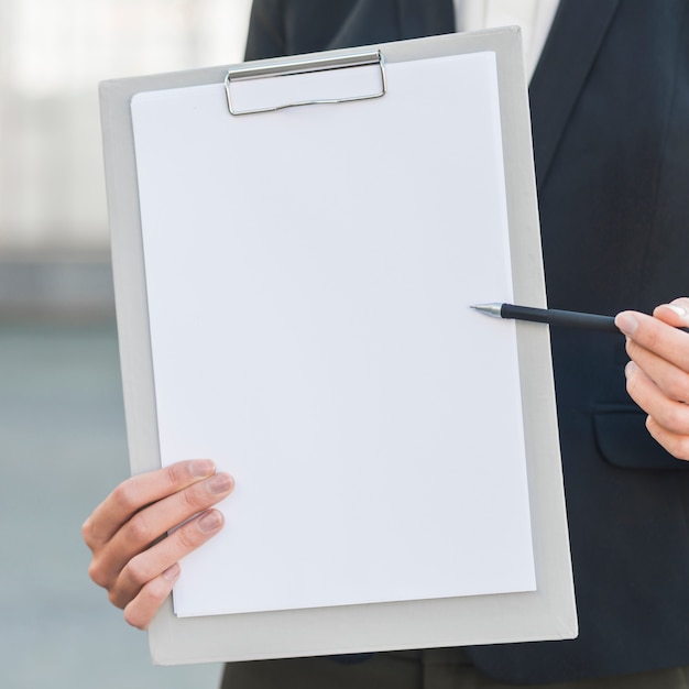 Free Photo | Businessman holding blank clipboard Free Photo | Businessman holding blank clipboard