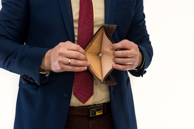 Premium Photo | Businessman holding an empty wallet Premium Photo | Businessman holding an empty wallet