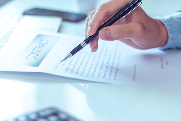 Premium Photo | Businessman reading documents in office. Premium Photo | Businessman reading documents in office.