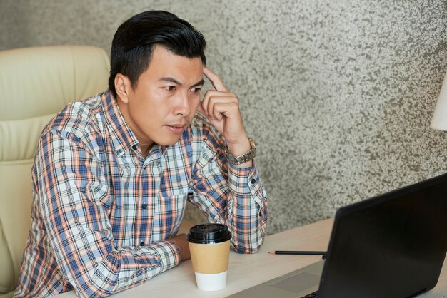 Premium Photo | Businessman reading e-mails Premium Photo | Businessman reading e-mails