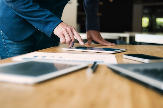 Premium Photo | Businessman using tablet analyse data. Premium Photo | Businessman using tablet analyse data.