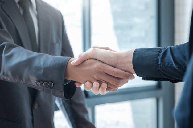 Premium Photo | Businessmans handshake. Premium Photo | Businessmans handshake.