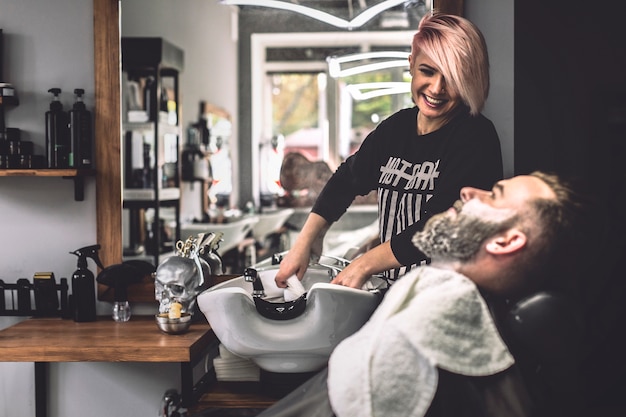 Free Photo | Cheerful barber and client preparing for treatment Free Photo | Cheerful barber and client preparing for treatment