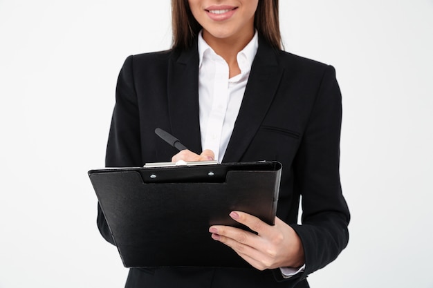 Free Photo | Cheerful business woman holding clipboard. Free Photo | Cheerful business woman holding clipboard.
