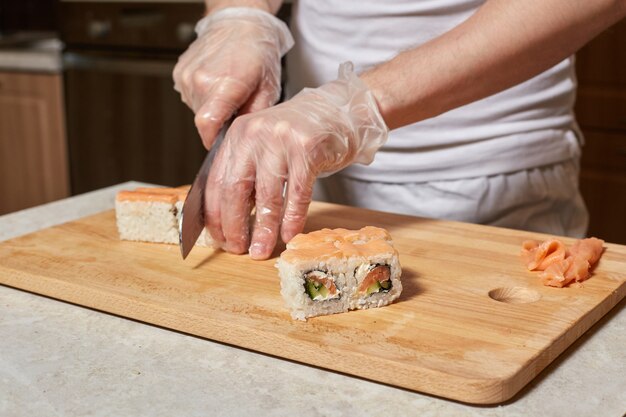 Premium Photo | Chef making sushi Premium Photo | Chef making sushi
