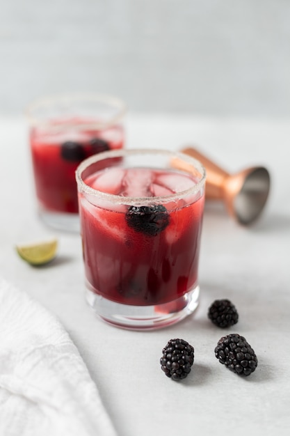 Free Photo Clear Drinking Glass With Red Liquid And Ice Cubes