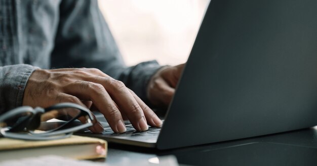 Premium Photo | Close up businessman using laptop computer Premium Photo | Close up businessman using laptop computer