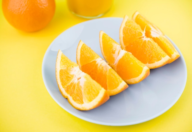 Free Photo | Close-up organic orange slices on a plate Free Photo | Close-up organic orange slices on a plate
