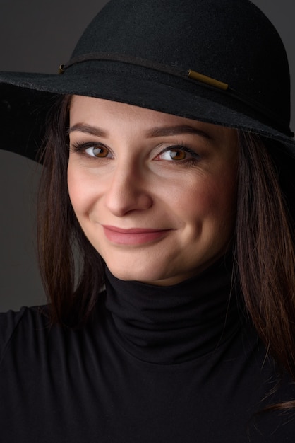 Premium Photo Close Up Portrait Of A Beautiful Woman Wearing A Black Hat