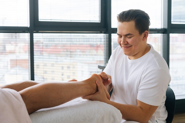 Premium Photo Closeup Of Cheerful Professional Male Masseur With