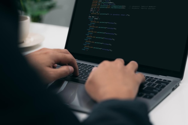 Premium Photo | Closeup of a man's hands coding html and programming on ...