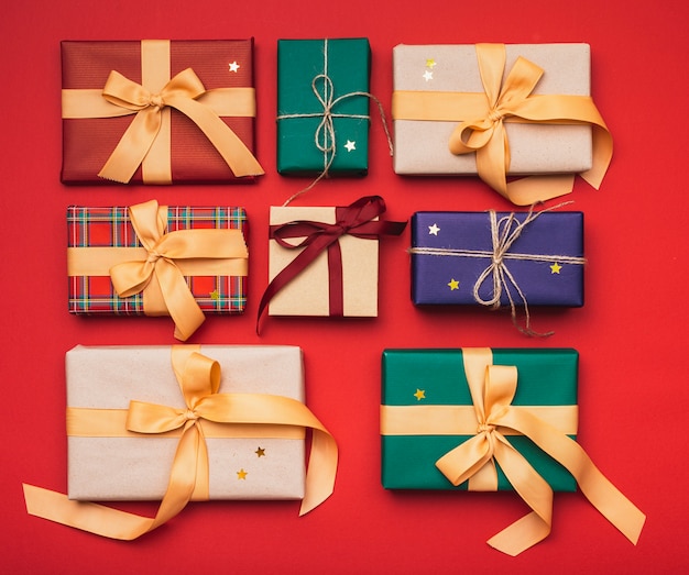 Premium Photo | Colorful christmas presents arranged with ribbon Premium Photo | Colorful christmas presents arranged with ribbon