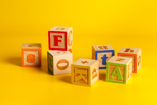Premium Photo | Colorful wooden blocks with letters Premium Photo | Colorful wooden blocks with letters