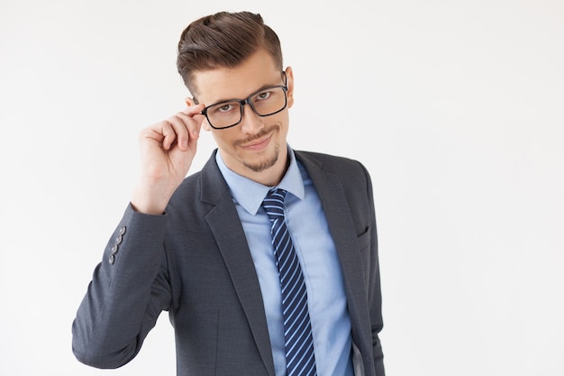 Confident Stylish Business Leader Adjusting Glasses Photo Free Download