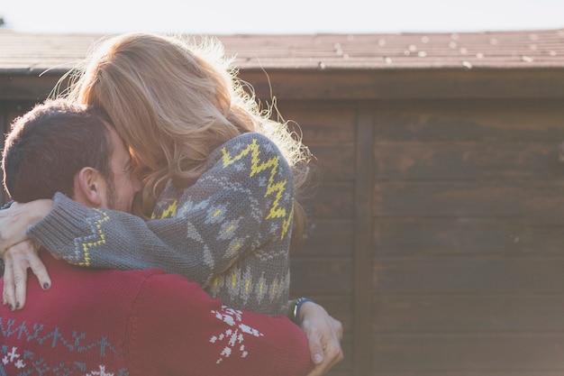 Free Photo | Couple embracing at wall Free Photo | Couple embracing at wall