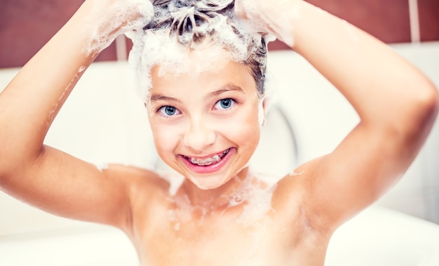 Premium Photo Cute Young Girl In Shower Washing Hair And Face With
