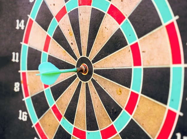 Premium Photo | Dart in bullseye center of target on aged dartboard Premium Photo | Dart in bullseye center of target on aged dartboard