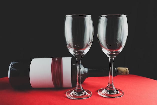 Free Photo Empty Wine Glasses With A Bottle Next To It