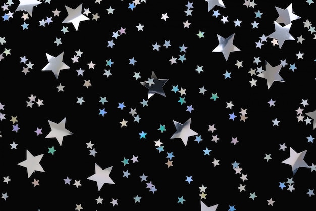Premium Photo Falling Silver Stars Confetti On Black Background