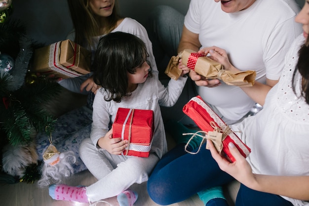 Free Photo | Family unwrapping gifts Free Photo | Family unwrapping gifts