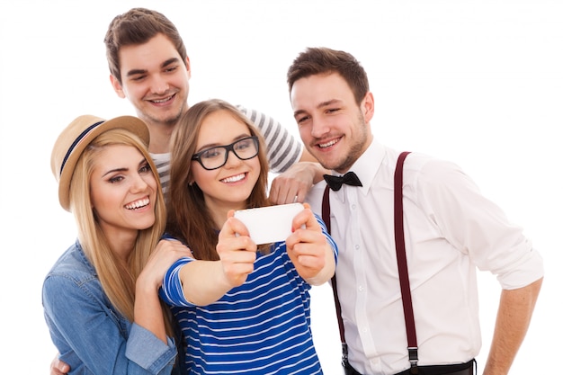 Premium Photo | Four stylish young people on white background Premium Photo | Four stylish young people on white background