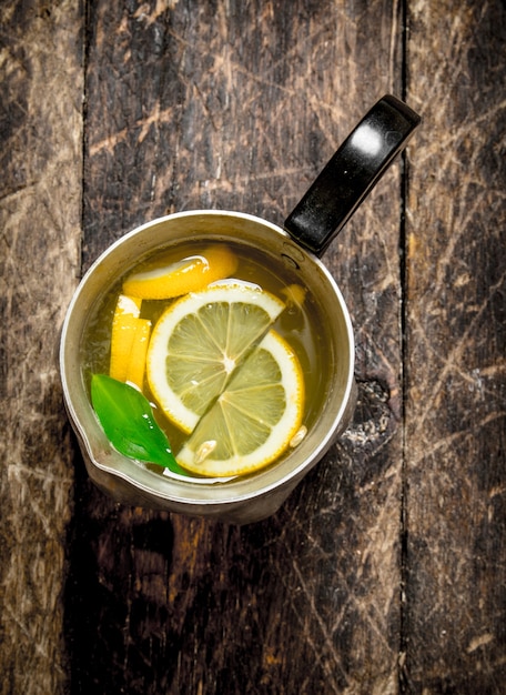 Premium Photo Fresh Lemonade In A Jug With Slices Of Lemon