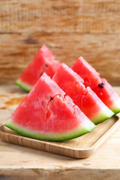 Free Photo | Fresh sliced watermelon on wooden background Free Photo | Fresh sliced watermelon on wooden background