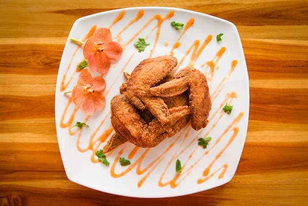 Premium Photo Fried Chicken Wings Served On Plate With Sauce Top View