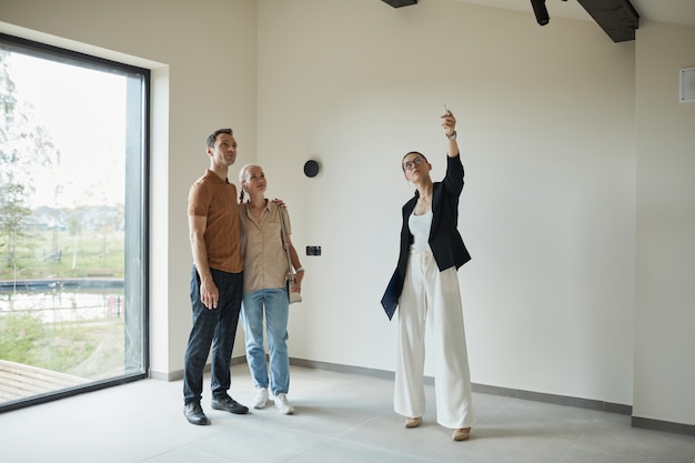 Premium Photo | Full length portrait of female real estate agent giving ... Premium Photo | Full length portrait of female real estate agent giving ...