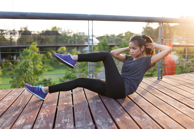 Girl Doing Sit Ups Outdoors Photo Free Download