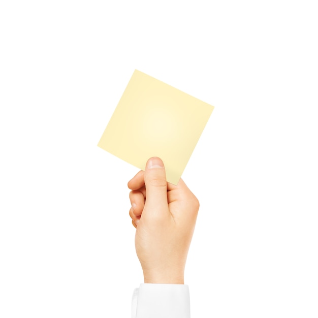Premium Photo | Hand holding square blank yellow sticker isolated Premium Photo | Hand holding square blank yellow sticker isolated