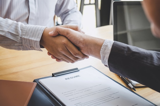 Handshake while job interviewing, candidate shaking hands with ... Handshake while job interviewing, candidate shaking hands with ...
