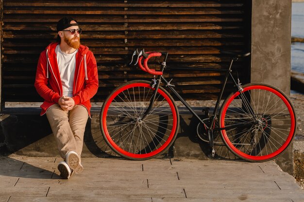 Free Photo | Handsome hipster style bearded man in red hoodie sitting ... Free Photo | Handsome hipster style bearded man in red hoodie sitting ...